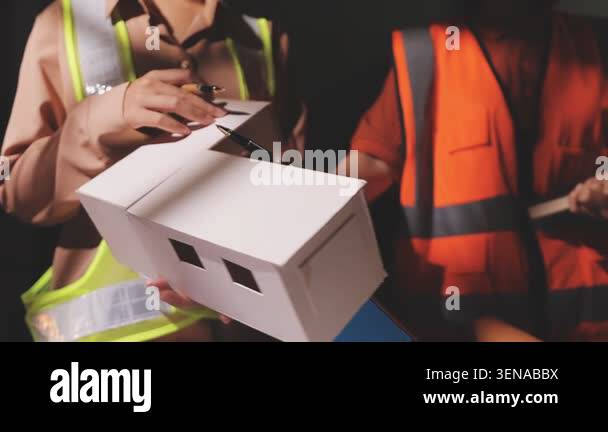 construction workers in uniform and safety helmet holding tools and ...