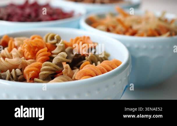 Bowls hold different types of pasta ready for cooking and recipes Stock ...