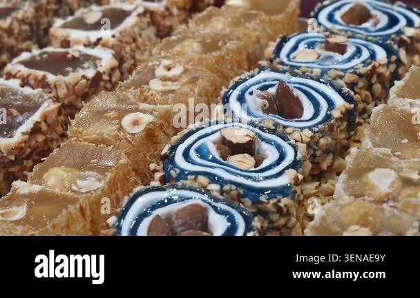 People taste and buy sweets at a Turkish dessert shop today Stock Video ...