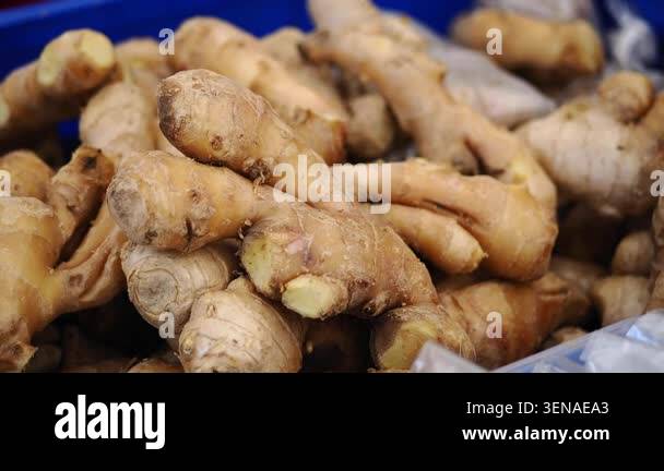 A market stall shows fresh ginger roots ready for customers Stock Video ...