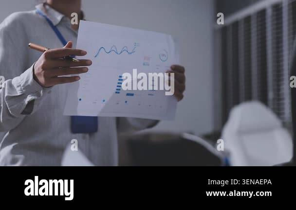 businessman holding a chart in his office. concept of teamwork Stock ...
