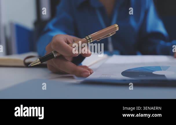 businesswoman hand holding pen and writing on paper Stock Video Footage ...