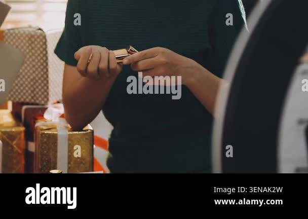 woman holding small gift boxes in her hands Stock Video Footage - Alamy