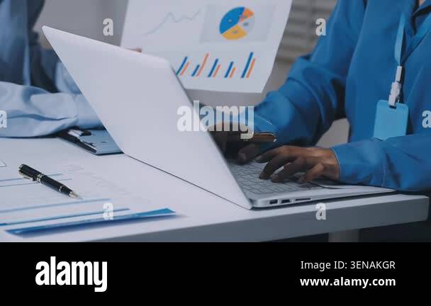 close - up of business people using laptop and analyzing graph Stock ...
