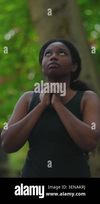 Young African American Woman reflecting on faith and purpose in a ...