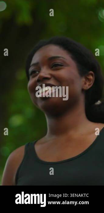 Young African American Woman embracing an uplifting outdoor experience ...