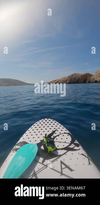 Paddleboard on calm sea near rocky coast Croatia Krk Stock Video ...