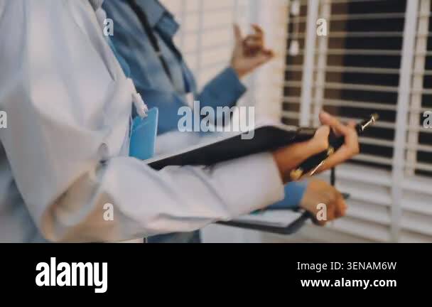 young female doctor holding a tablet in his hand Stock Video Footage ...