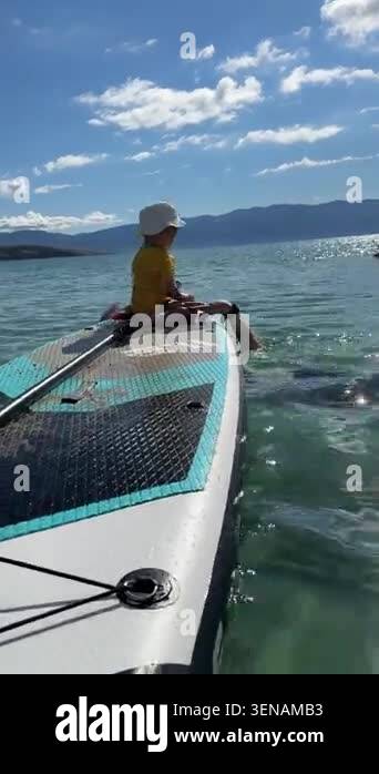 Father and child in calm lake by paddleboard Croatia Krk Stock Video ...