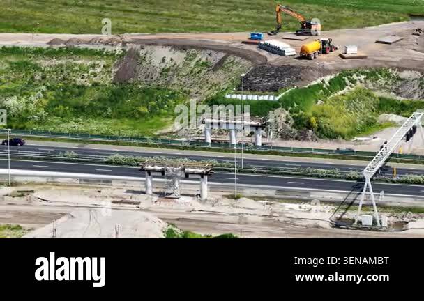 Aerial view of a major highway expansion project, featuring concrete ...