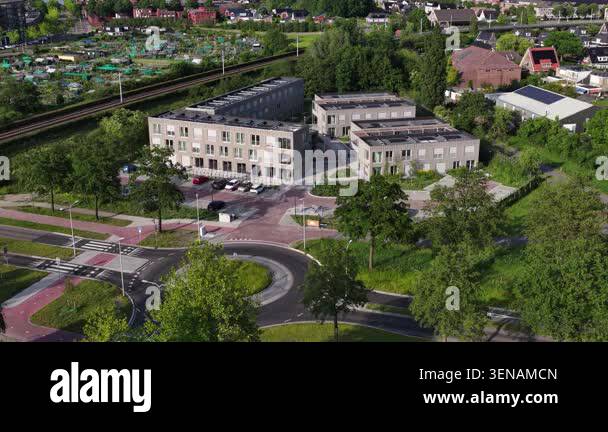 Aerial circling shot of a modern apartment complex providing temporary ...