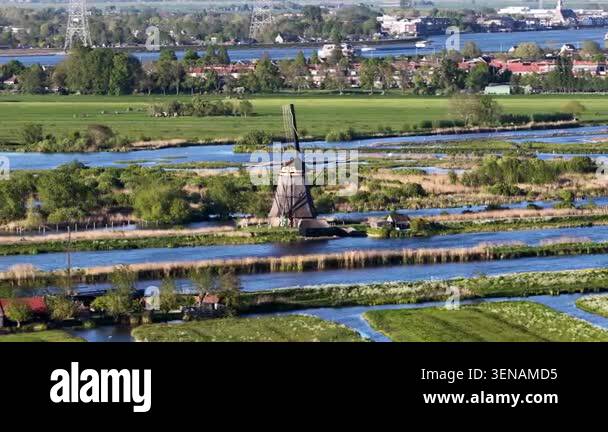 Famous historical windmill standing in the iconic polder landscape of ...
