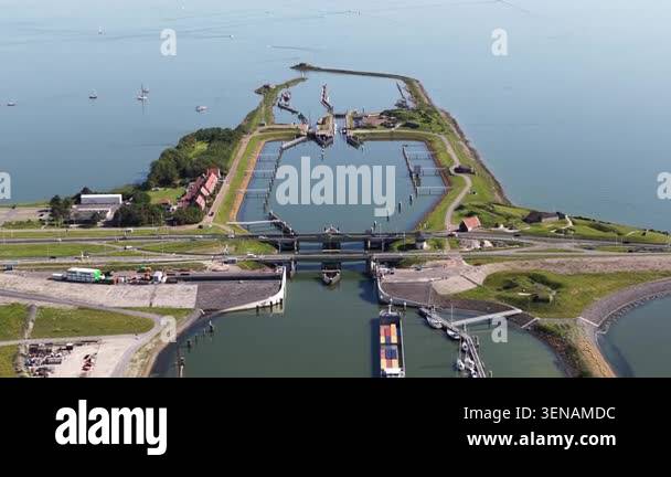 High angle aerial view of a large cargo ship navigating the ...