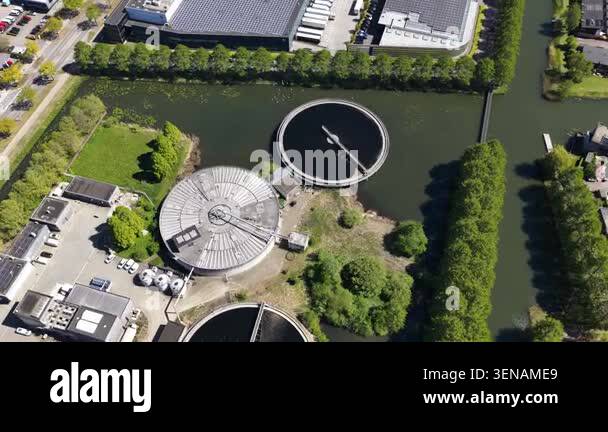 High angle drone footage showing a modern wastewater purification ...