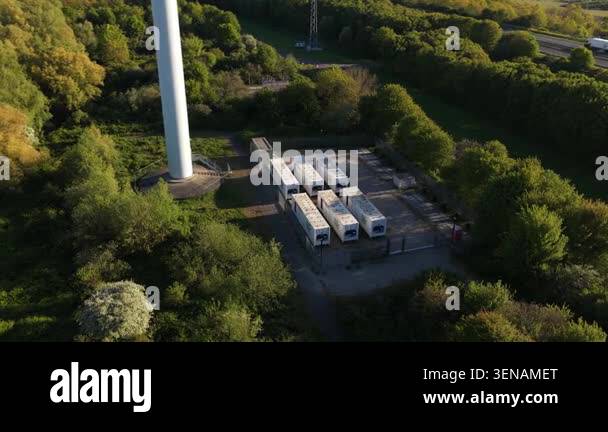 Aerial drone view of BESS technology at a wind park, showing battery ...