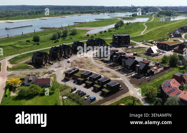 Aerial drone view of an ecovillage with sustainable homes, shared ...
