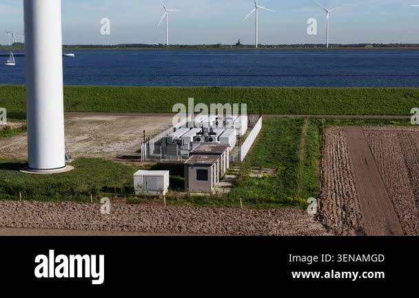 Aerial drone view of BESS technology at a wind park, showing battery ...