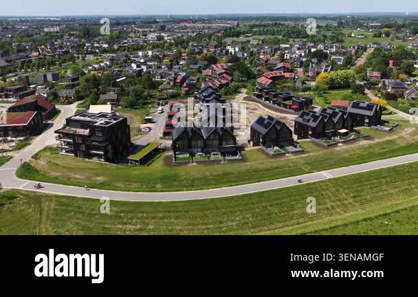 Aerial drone view of an ecovillage with sustainable homes, shared ...
