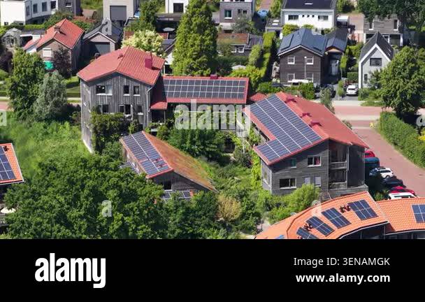 Aerial drone view of an ecovillage with sustainable homes, shared ...