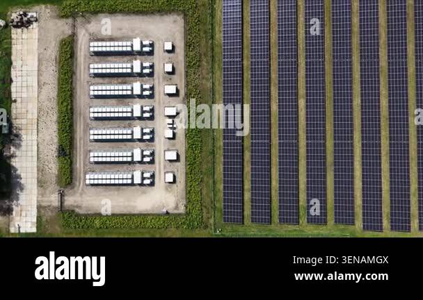 Top down aerial view of a large scale solar farm with rows of ...