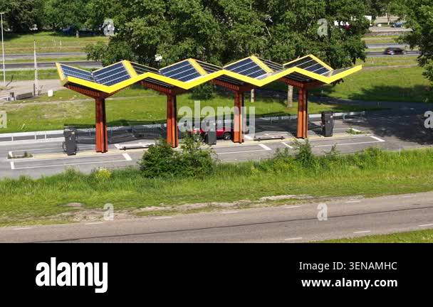 Modern electric vehicle charging station with a distinctive solar panel ...