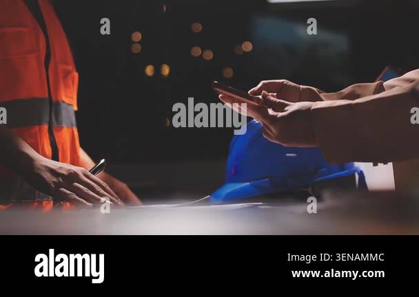 construction worker in uniform and helmet at work in construction site ...