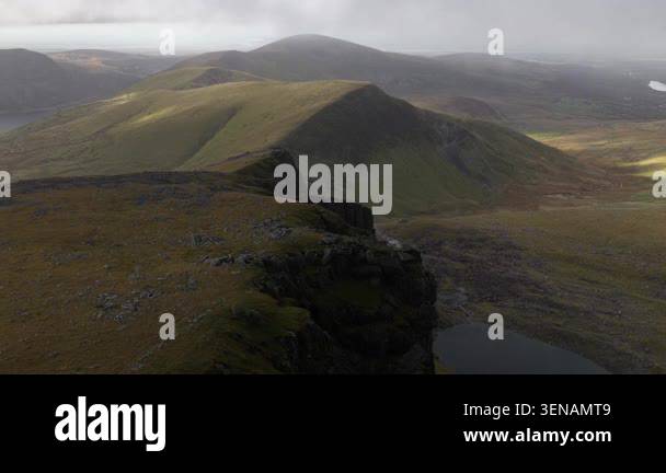 Breathtaking aerial view of a majestic mountain range, where dramatic ...