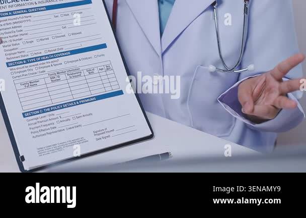 doctor writing on clipboard Stock Video Footage - Alamy