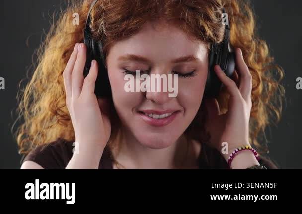Music Enjoyment And Relaxation Concept, Young Woman With Red Curly Hair ...