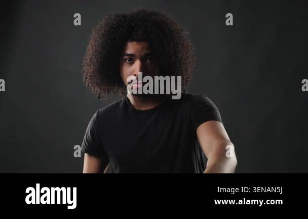 Confident Young Man With Afro Hairstyle And Beard Posing In Black T ...