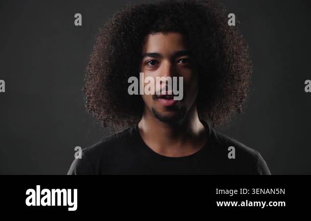Young Man With Curly Hair Looking At Camera And Talking, Headshot On ...