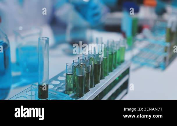 laboratory glassware with blue liquid Stock Video Footage - Alamy