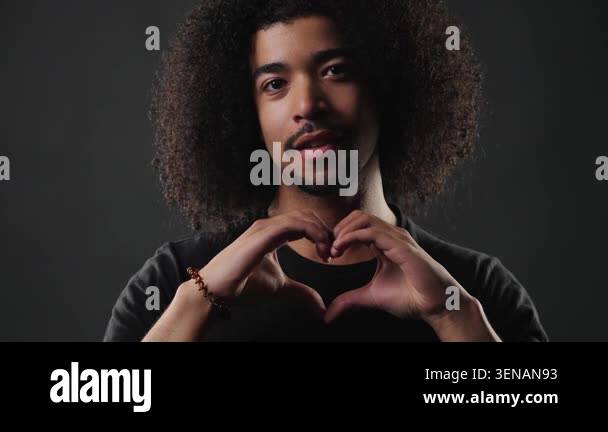 Love And Connection Concept, Young Man With Curly Hair Making Heart ...