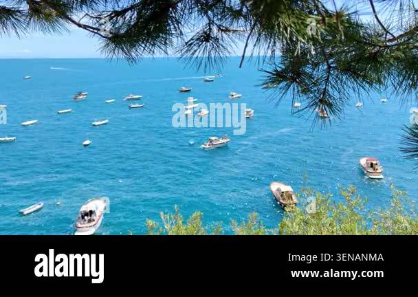 High angle view of boats in blue sea near rocky shore Stock Video ...