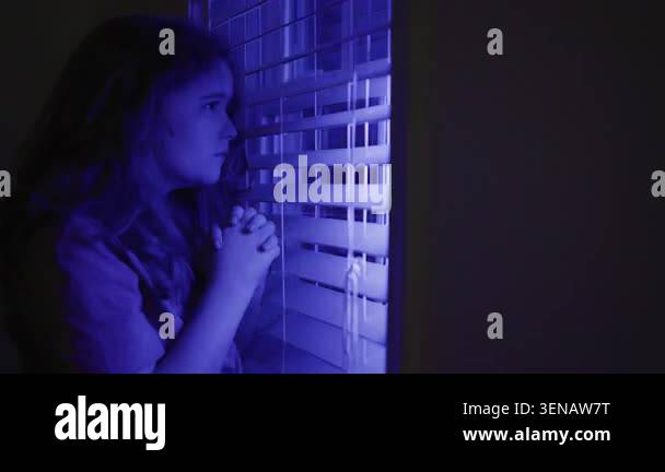 Fear fills child face in night room with police siren. Child fear under ...