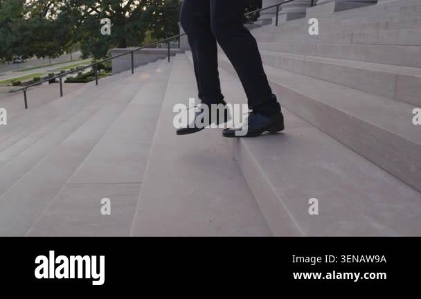 Business man taking a bold step toward success. Businessman moving step ...