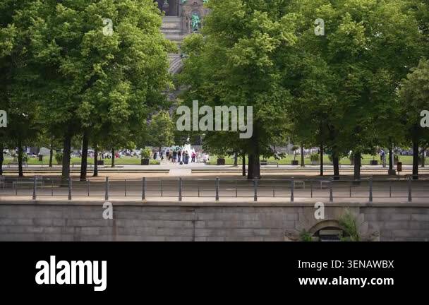 Leafy linden trees frame the Lustgarten near the Berlin Cathedral and ...