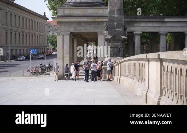 Germany, Berlin, June 2, 2026. Visitors gather near a bright stone ...