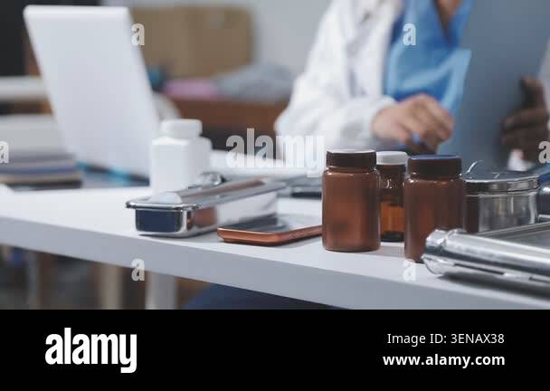 professional female doctor working with laptop computer and digital ...