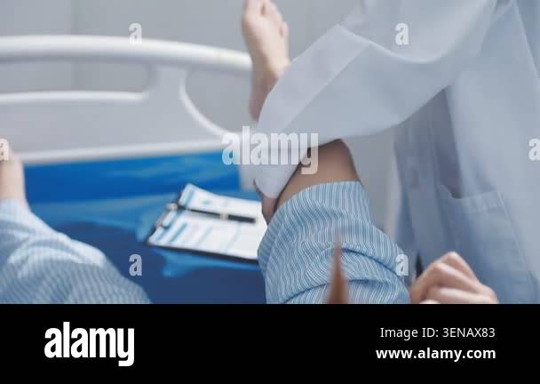 doctor holding patient 's hand in hospital ward Stock Video Footage - Alamy