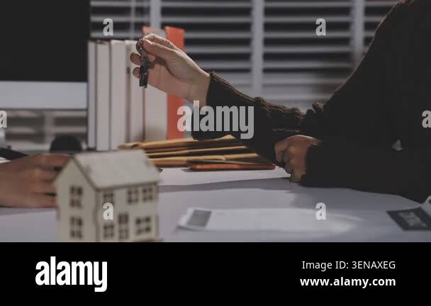 real estate agent showing house model to customer Stock Video Footage ...