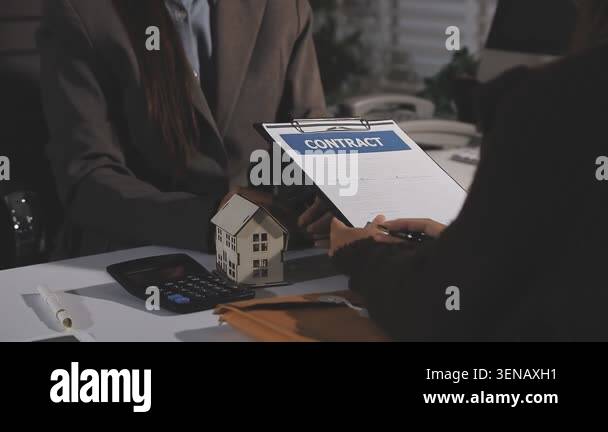 business people shaking hands with real estate agent in office Stock ...