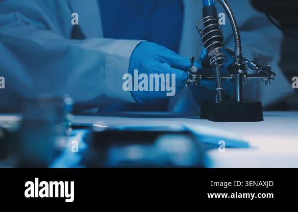 close up of hands of scientist using microscope in laboratory Stock ...