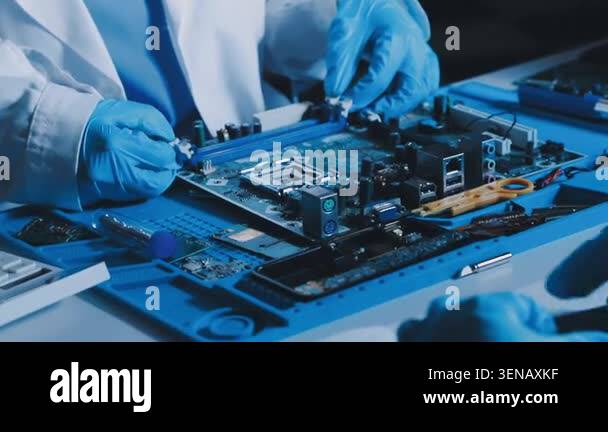 technician repairing computer circuit board with screwdriver Stock ...
