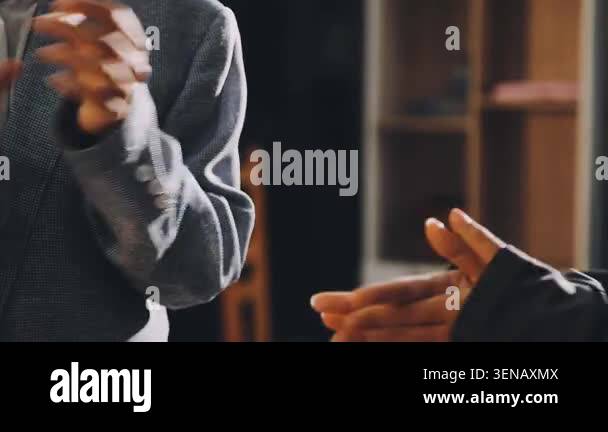 african american male in black shirt and black jacket shaking hands ...