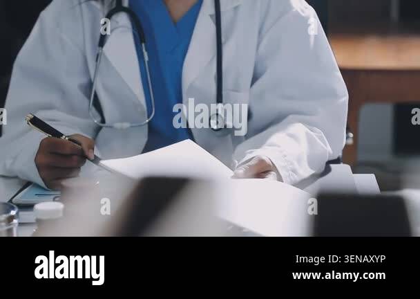 doctor writing on clipboard Stock Video Footage - Alamy