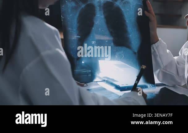 young asian doctor in uniform and medical uniform examining patients ...