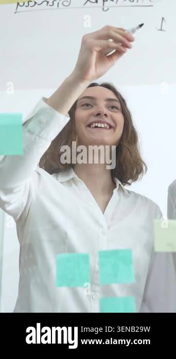 Focused businesswoman brainstorming ideas and planning a project by ...