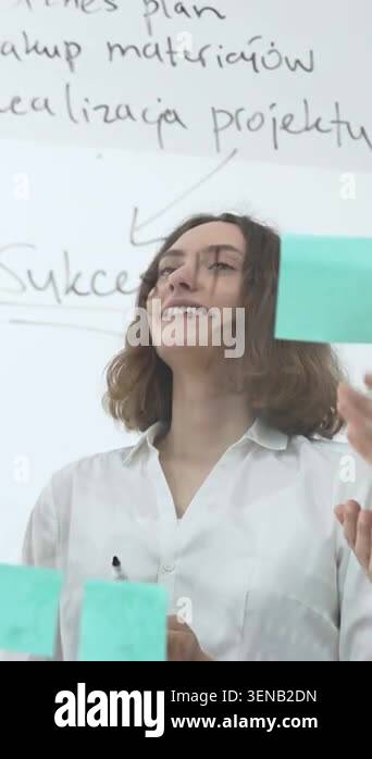 Focused businesswoman brainstorming ideas and planning a project by ...