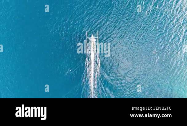 Overhead aerial drone shot of a traditional Balinese jukung boat ...